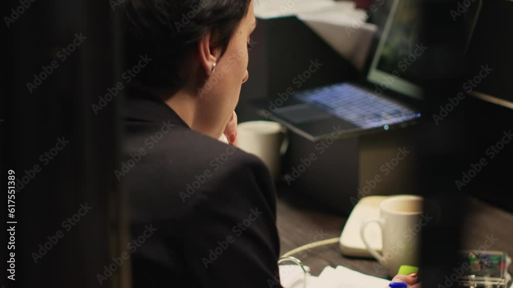 Police agent using landline phone, answering call and taking notes to ...