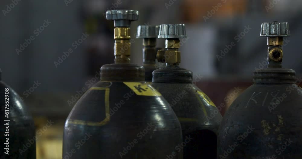 Black oxygen cylinders for welding and industry. Oxygen cylinder with ...