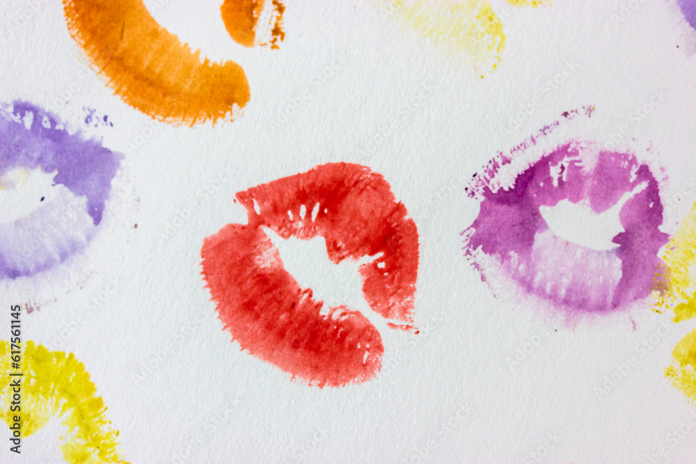 Set of multicolored female lip prints on white paper background top ...
