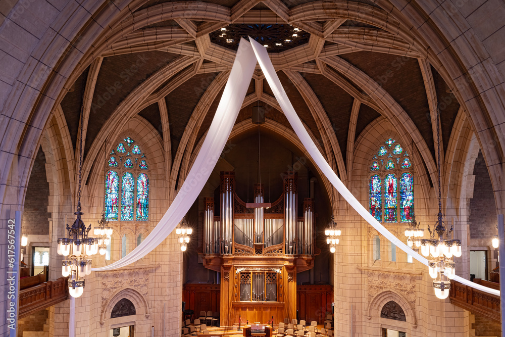 sanctuary and stained glass windows under rib vaulted ceiling of ...