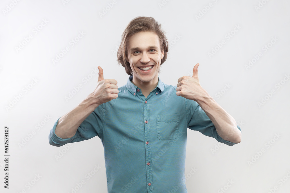 Smiling satisfied joyful attractive young man standing showing like ...