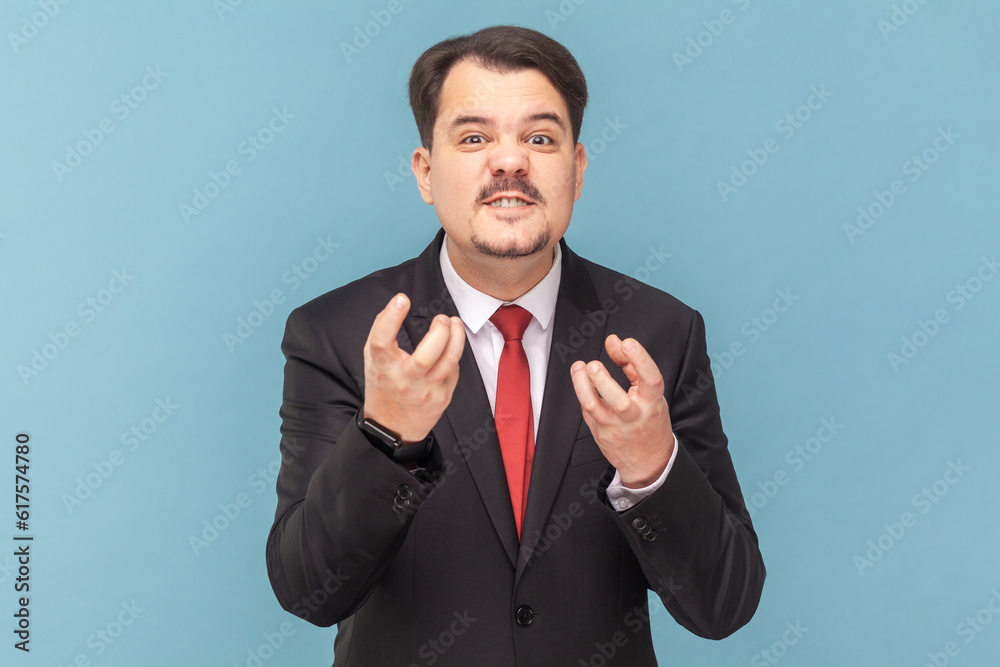 Portrait of angry aggressive man with mustache standing with raised ...