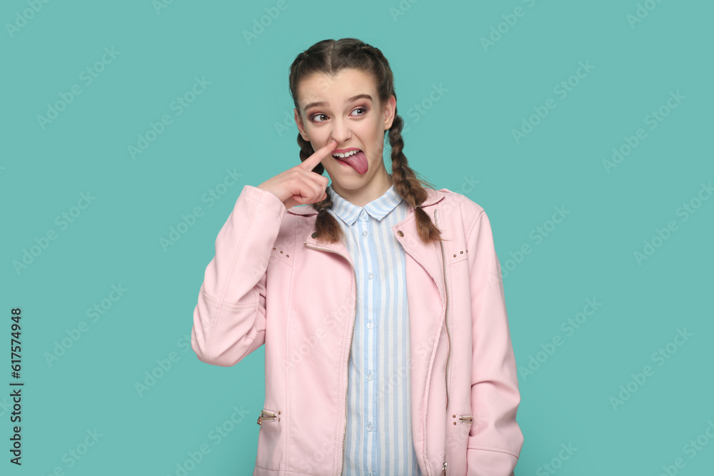 Portrait of funny childish teenager girl with braids wearing pink ...