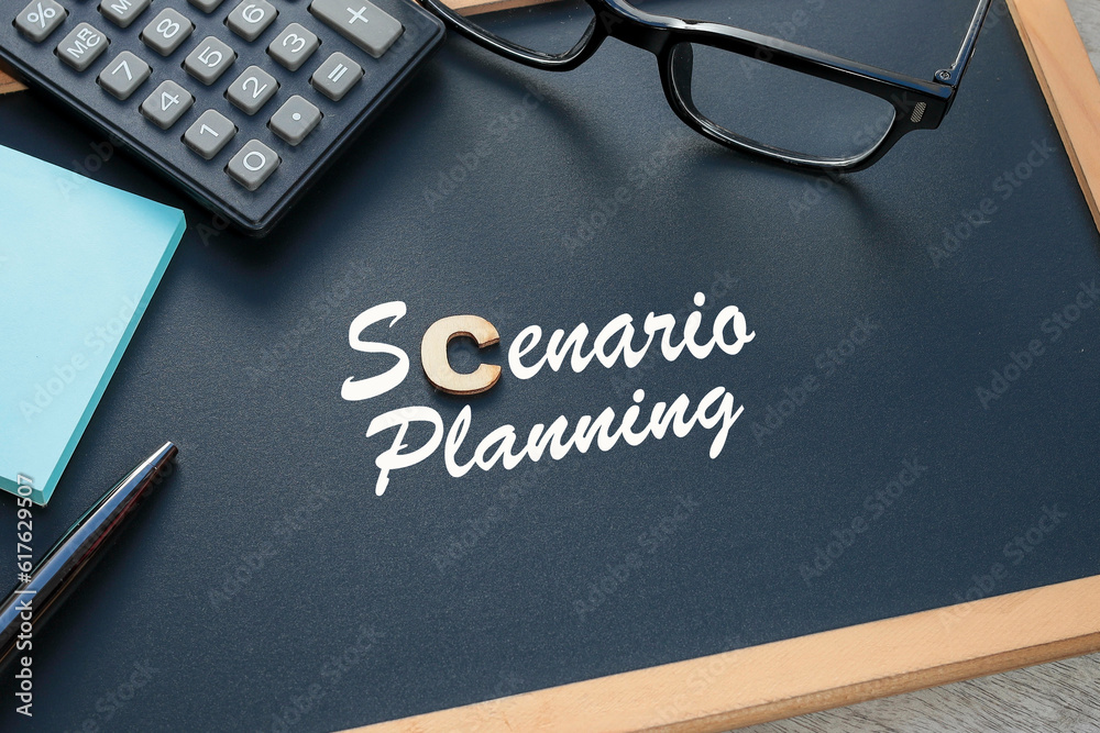 The word Scenario Planning on the black background with eyeglasses ...