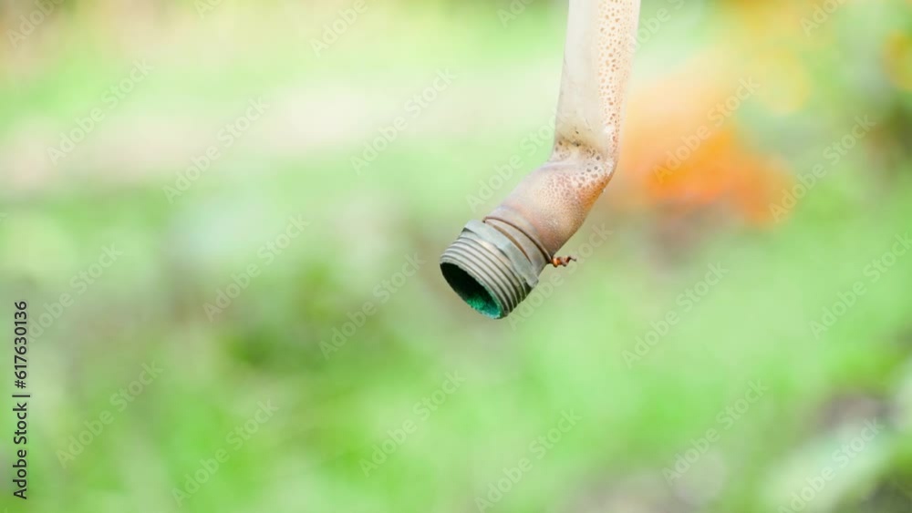 Close-up of an old plastic hose with a threaded connection with a ...