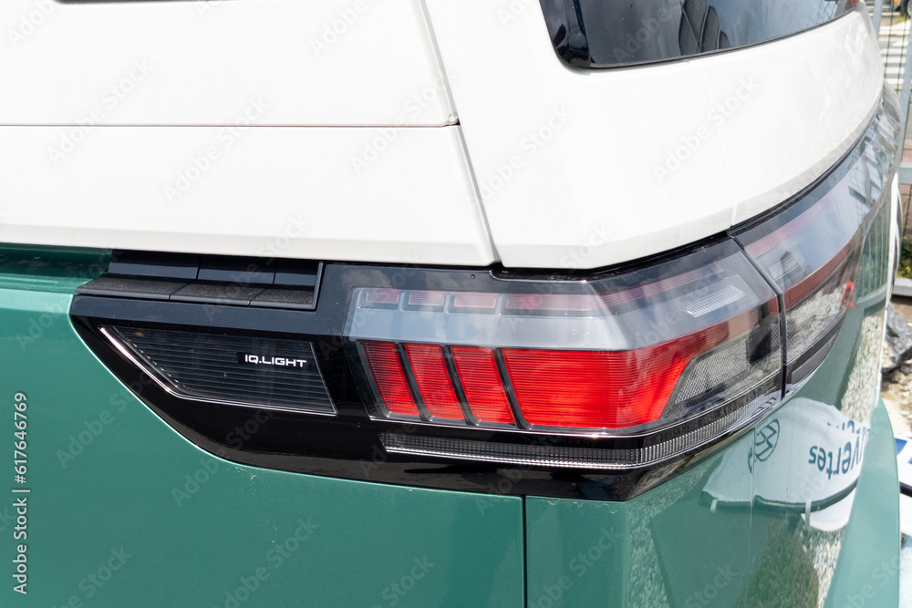 Volkswagen iD. Buzz sign text and logo brand on rear red light of ...