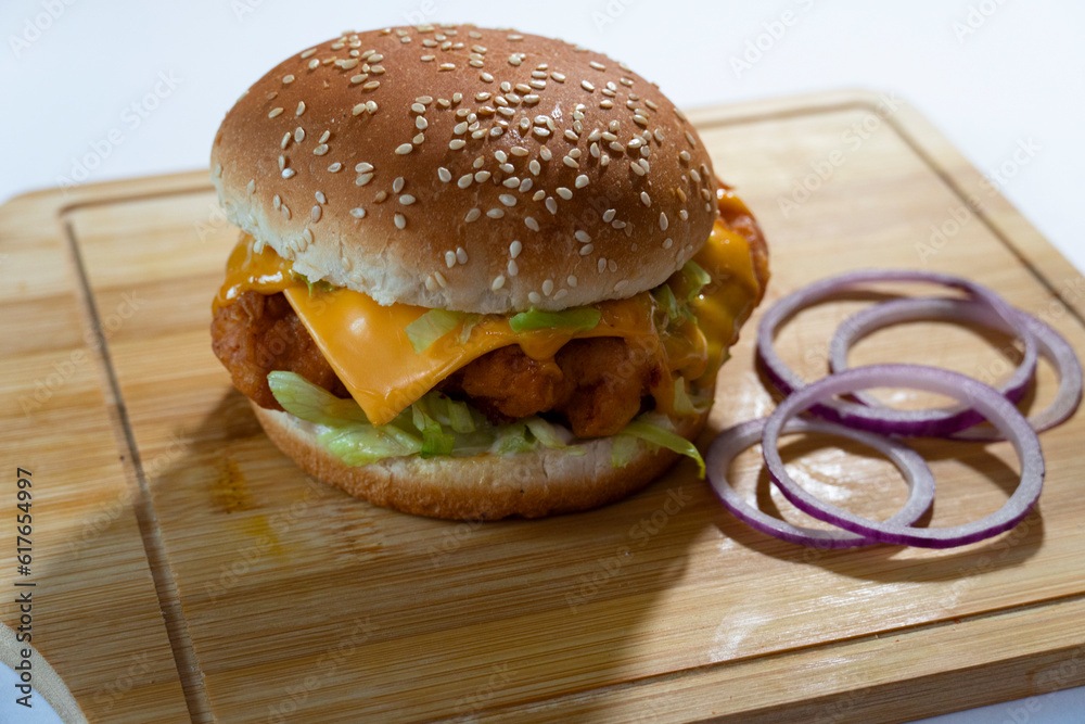 Crispy Cheesy Chicken Patty Zinger Burger with onion rings Stock Photo ...