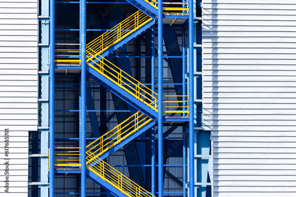 Metal construction fire escape ladder with blue and yellow . .Escape ...