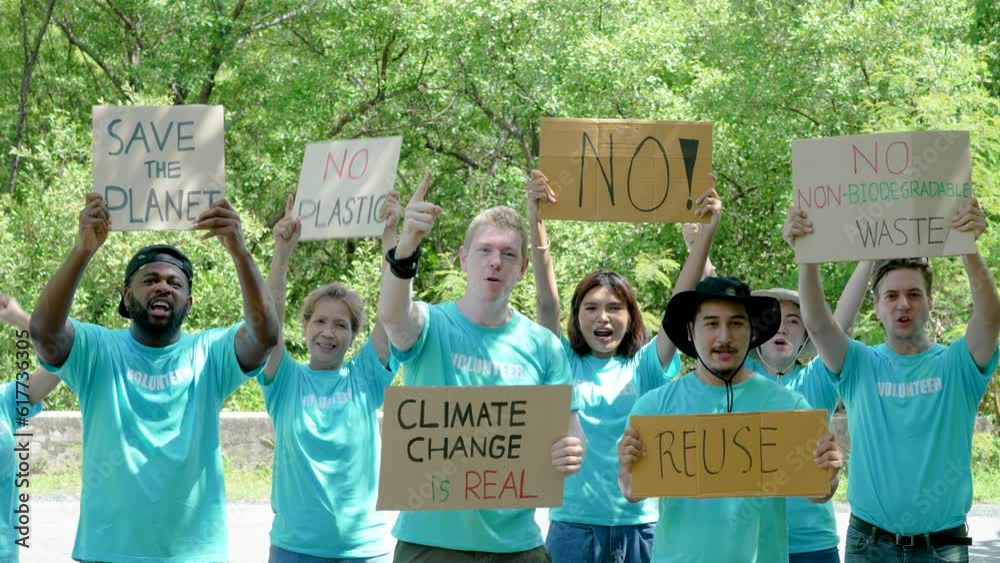 Volunteer group of people from different culture and carry posters for ...