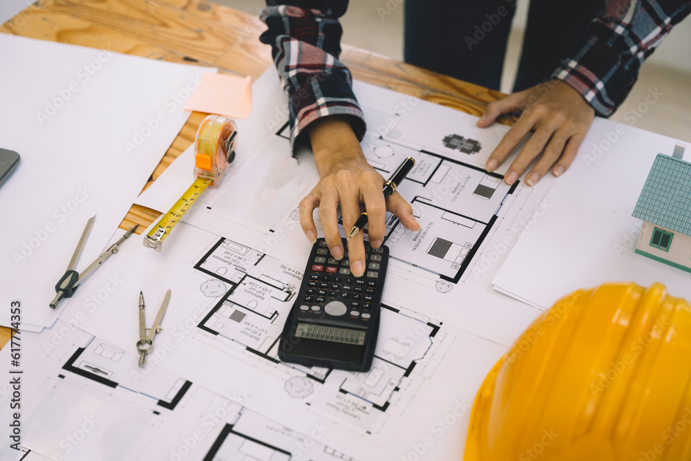 civil engineer or architect business useing calculator about calculate ...