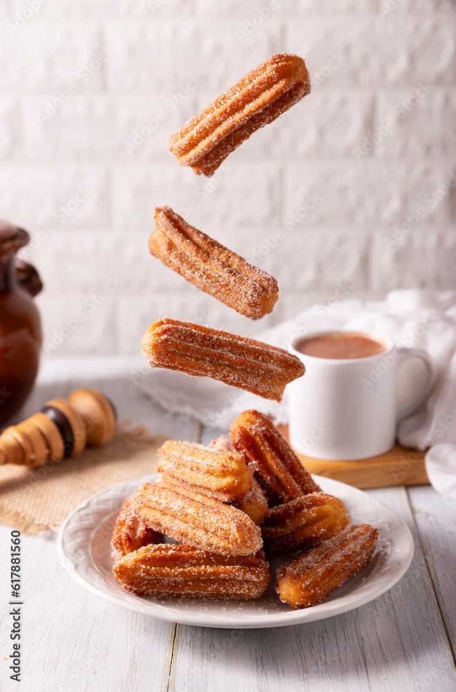Falling Churros. Fried wheat flour dough, a very popular sweet snack in ...