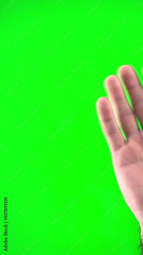 Male hand gesture isolated at bright green screen background. Punch and ...
