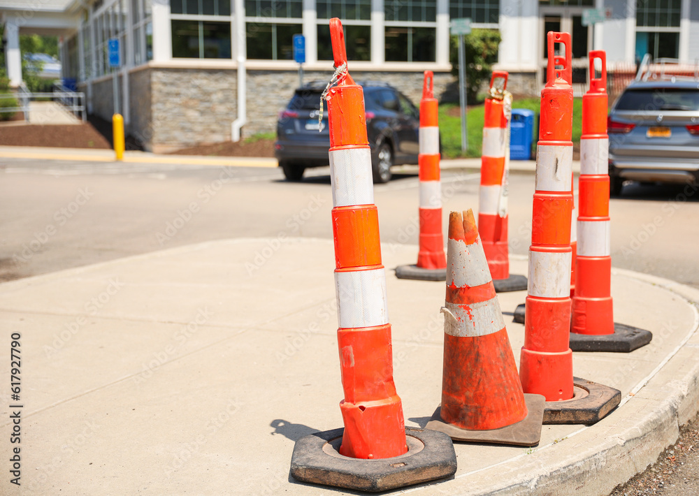 bright orange construction cones arranged in a line, symbolizing safety ...