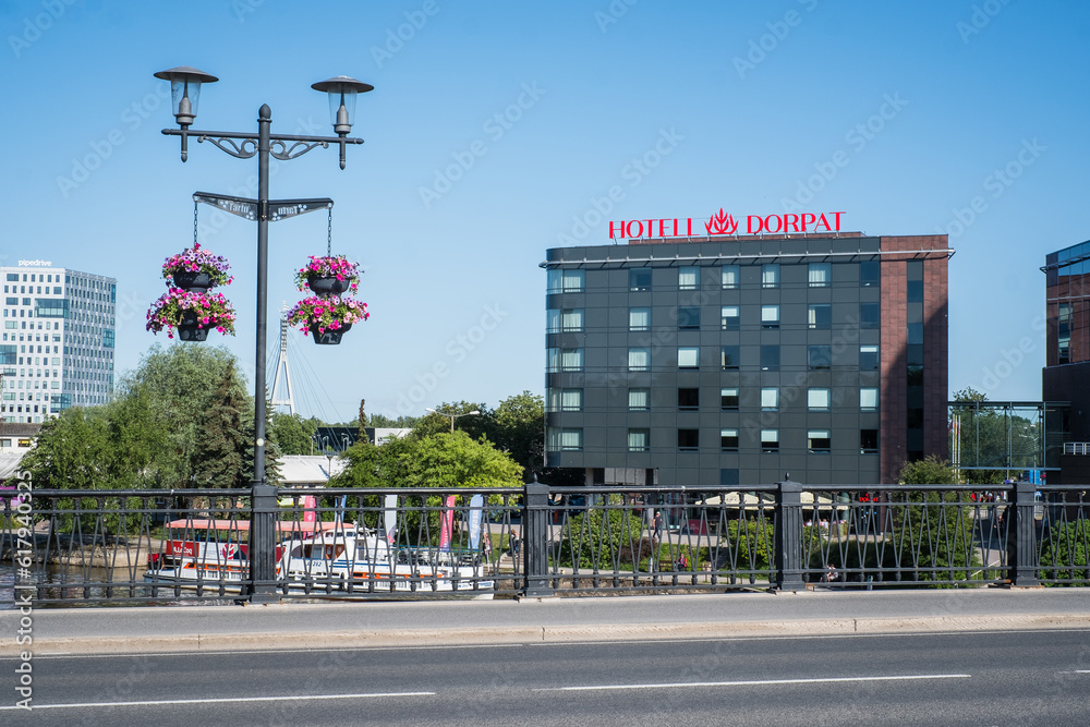 TARTU, Estonia - June 10, 2023: Hotel Dorpat seen across the river ...