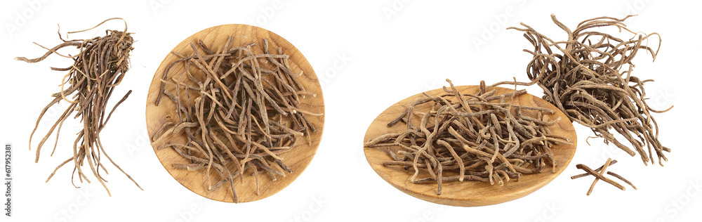 Dried Valerian root in wooden bowl isolated on white background ...