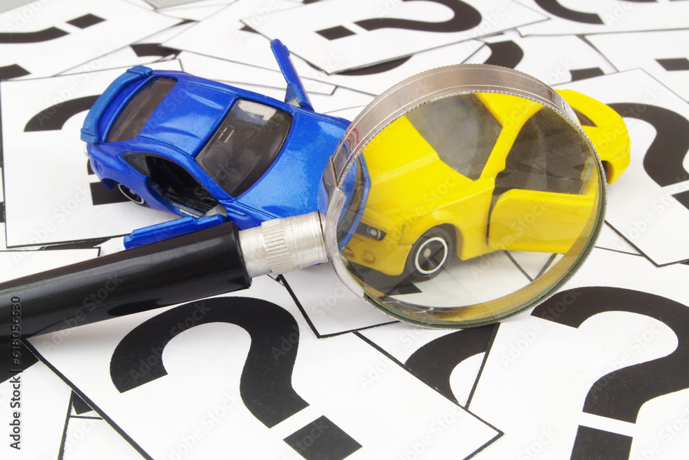 Poster Two cars under magnifying glass on question marks – Wall Art ...