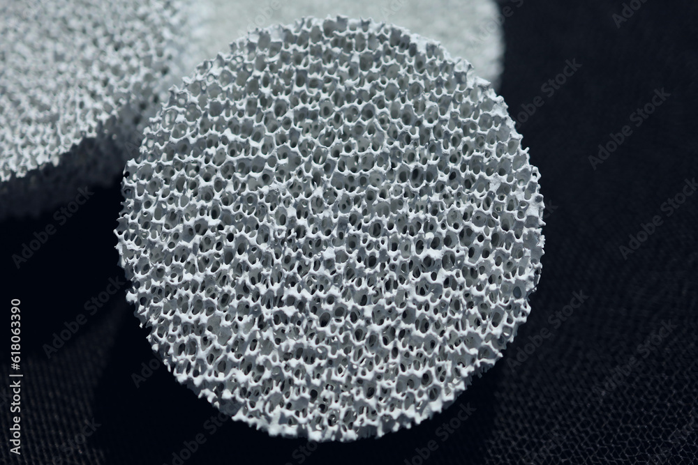 A close up macro shot of a white ceramic coated sponge created by nano ...