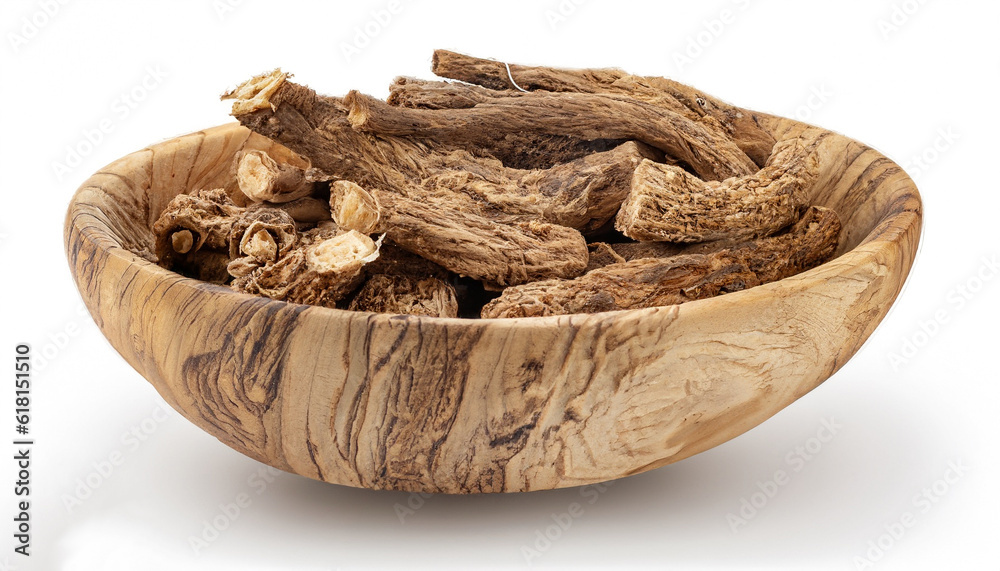 Calamus root in wooden bowl, isolated on white background. Sweet flag ...