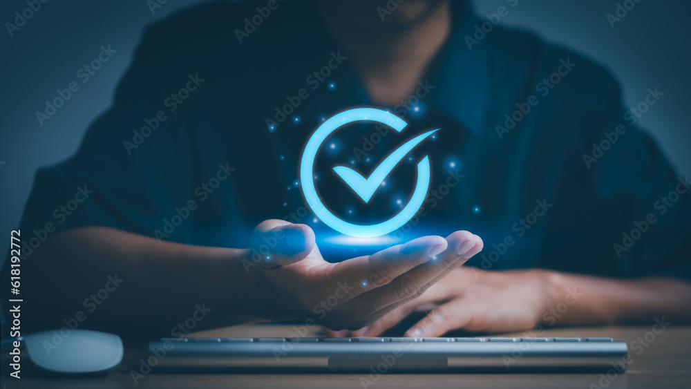 Businessman's hand showing quality control (QC) with icons on a virtual ...