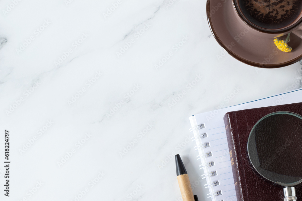 Holy bible, notebook, cup of coffee, pen, and magnifying glass on white ...
