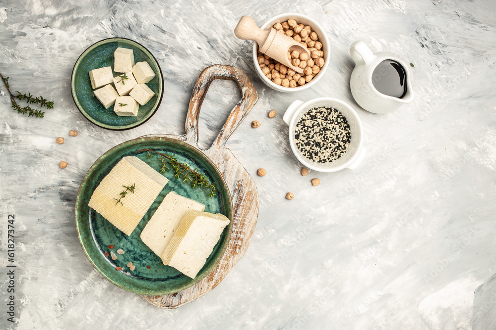 tofu cheese cubes on a light background. banner, menu, recipe place for ...