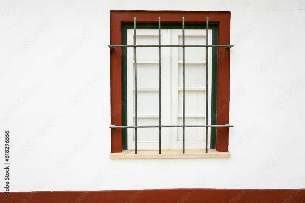 Fenced window frame in a wall Stock Photo | Adobe Stock