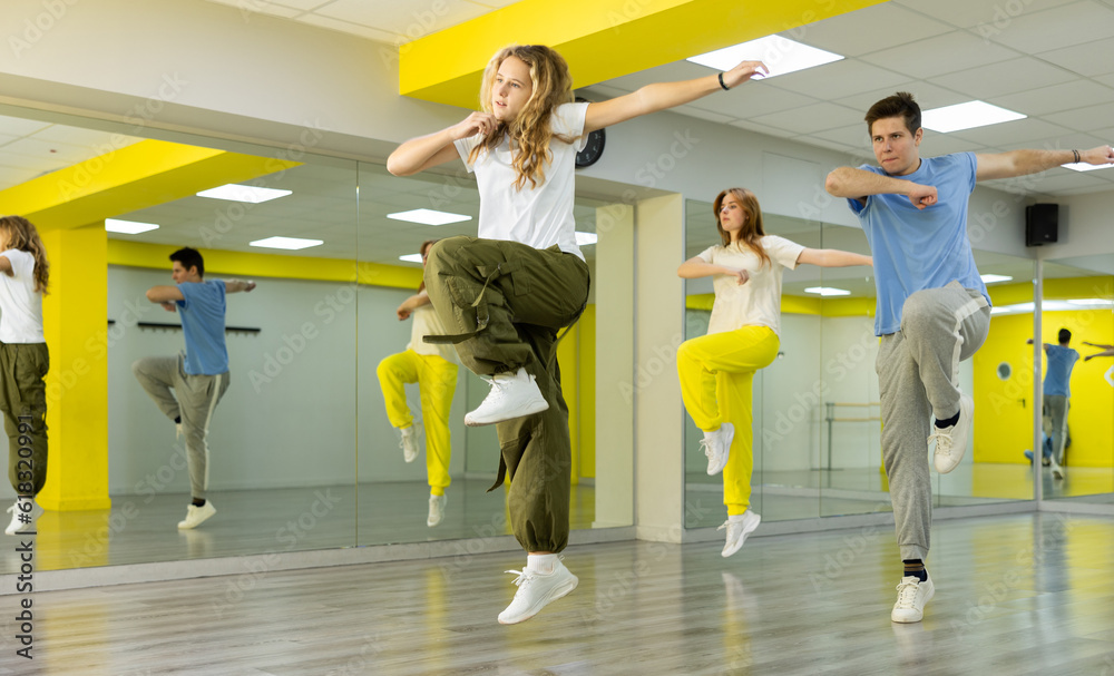 Teenage dancers young people jumping and practicing modern dance styles ...