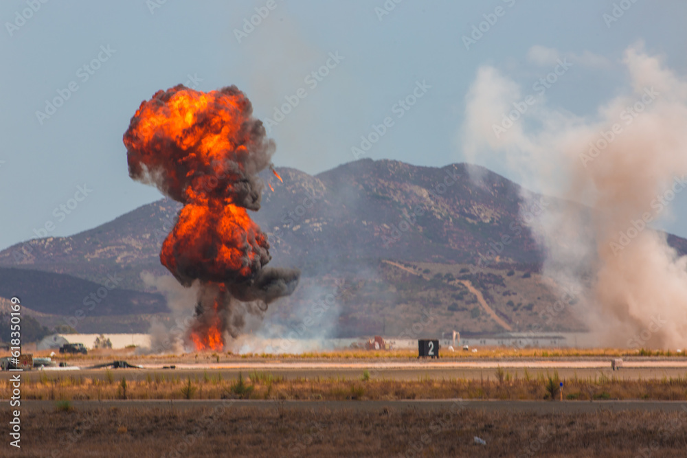 Military explosion drill detonating explosives to create a wall of fire ...