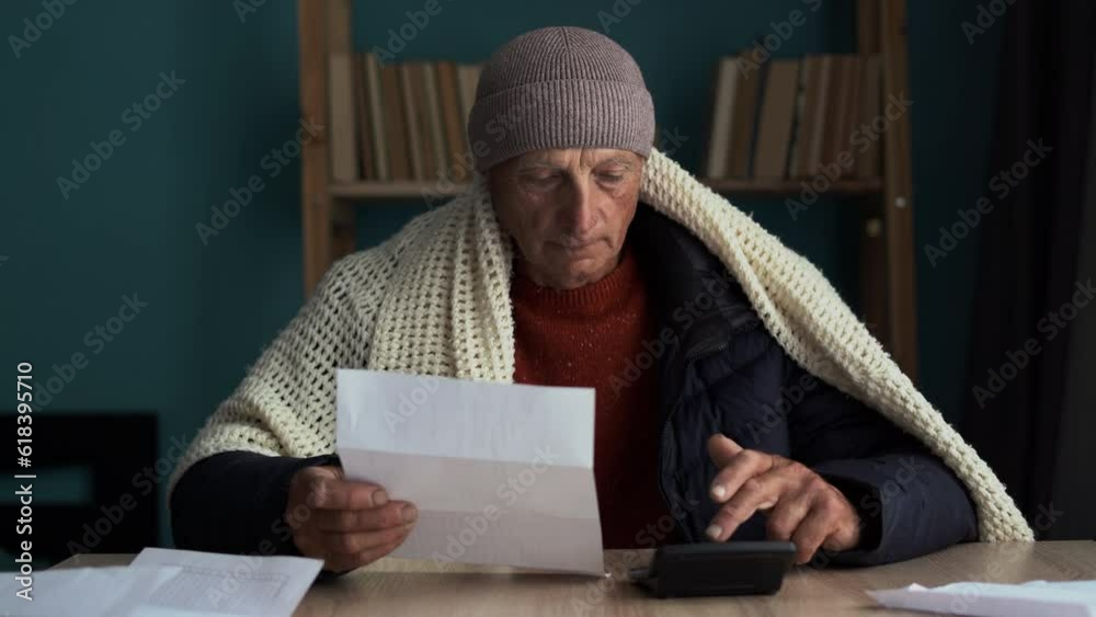 Upset poor bankrupt old man with no money freezing indoors at home ...