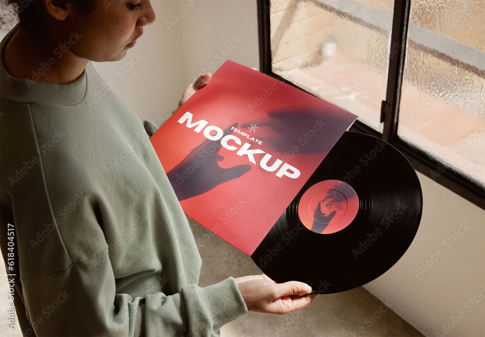 Mockup of person holding customizable LP vinyl record album cover with ...