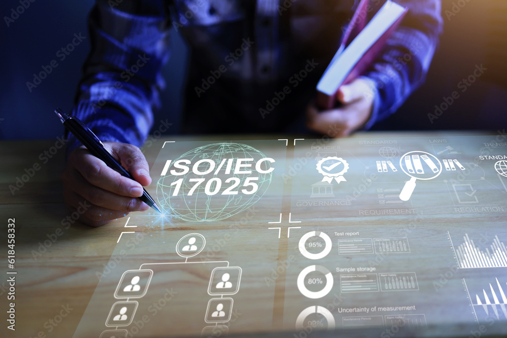 Business people design ISO IEC 17025 on the wooden table for testing ...