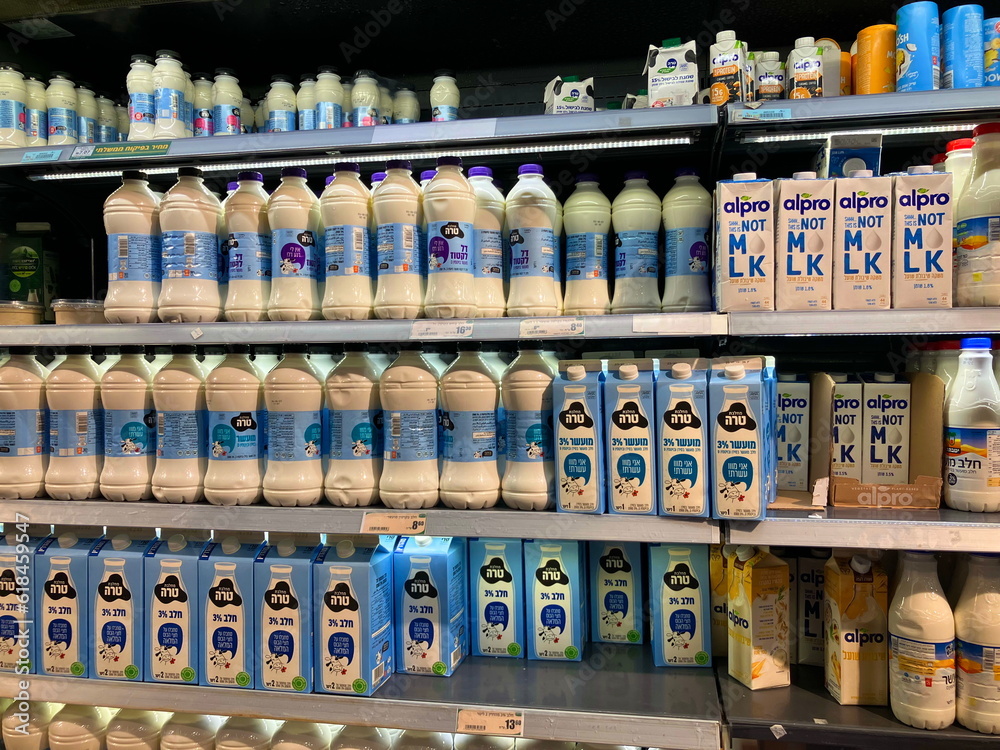 Israeli supermarket, dairy products.Showcase with milk. Milk in tetra ...