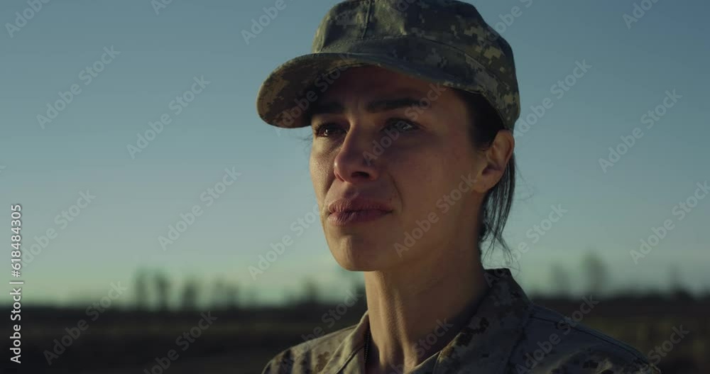 Slow Motion Close Up Portrait of Young Female Soldier Looking at the ...