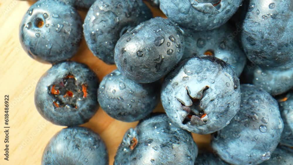 In a mesmerizing macro video, luscious blueberries glisten with ...