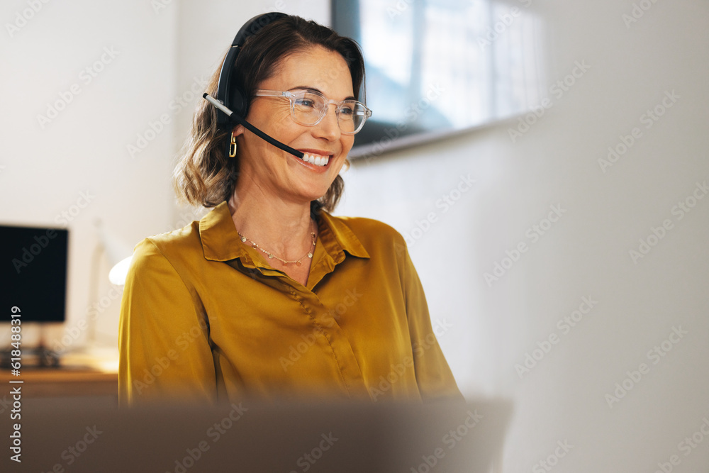 Friendly call center agent answering cals with a headset Stock Photo ...
