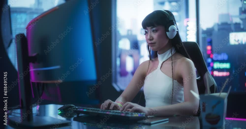 Creative Japanese Female Using Desktop Computer in a Futuristic High ...