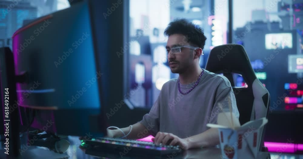 Handsome Young Man Eating Take-Away Asian Food, while Working on a ...