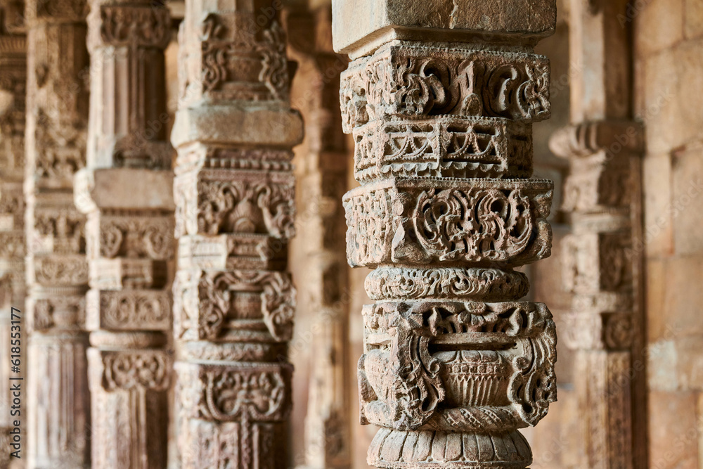 Stone columns with decorative bas relief of Qutb complex in South Delhi ...