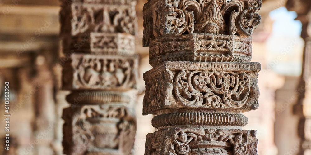 Stone columns with decorative bas relief of Qutb complex in South Delhi ...