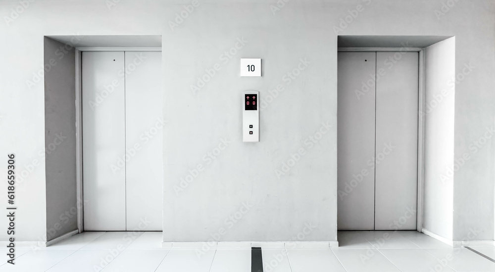 Elevators door closed in the hallway condominium. Light grey interior ...
