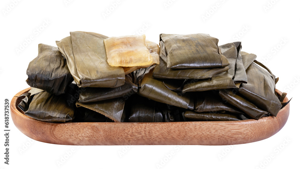Vietnam traditional Rice Dumpling cake wrapped in banana leaves in a ...
