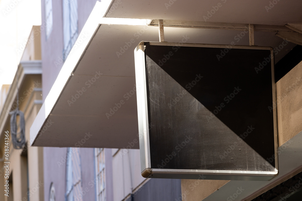 Blank sign hanging from building ceiling with copy space Stock Photo ...