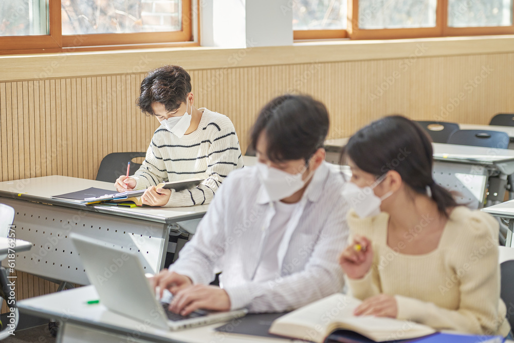 In a higher education classroom in South Korea, young university ...