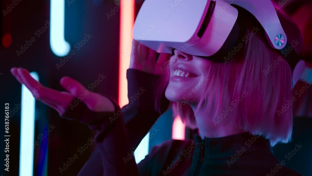 Woman in futuristic costume. Girl in glasses of virtual reality while ...