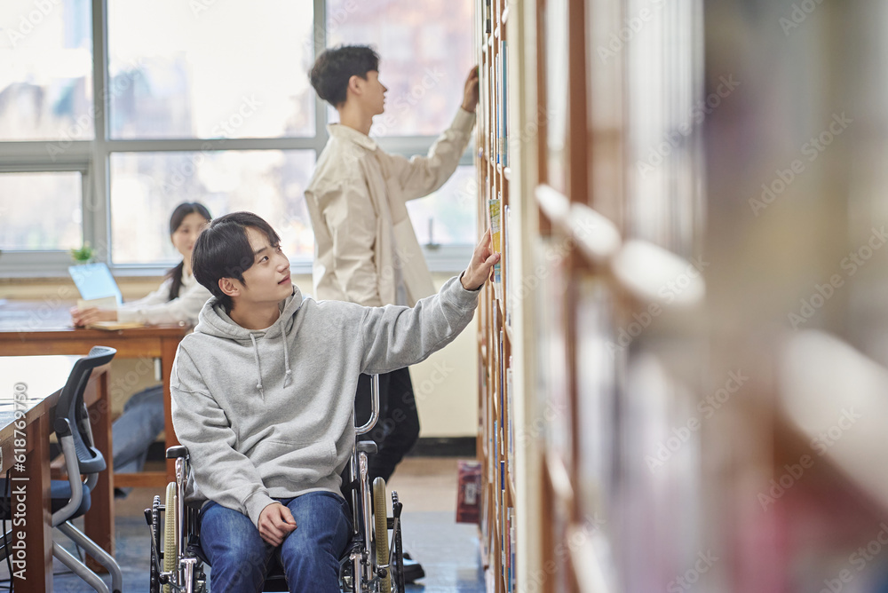 Young handicapped disabled male college student model in wheelchair ...