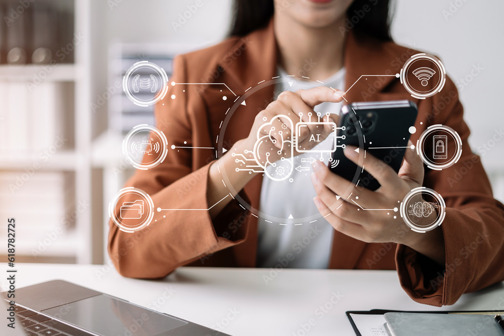 AI or Artificial Intelligence technology. Businessman using a smartphone and laptop computer ...