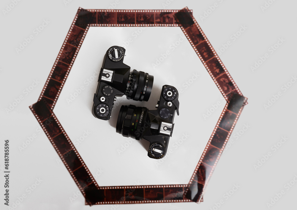 Old photo film roll and retro camera on desk. isolated on white ...