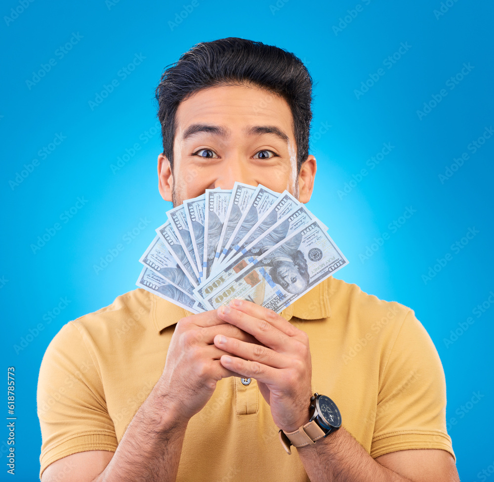 Cash, fan and man with wow face isolated on blue, studio background for ...