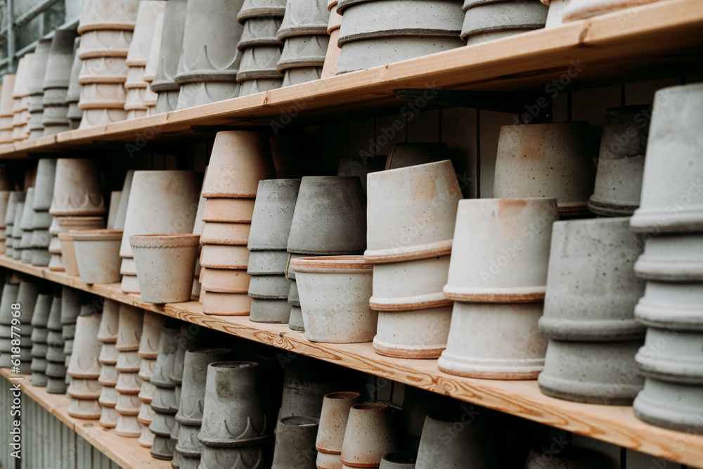 A variety of empty decorative ceramic flower pots in different sizes ...