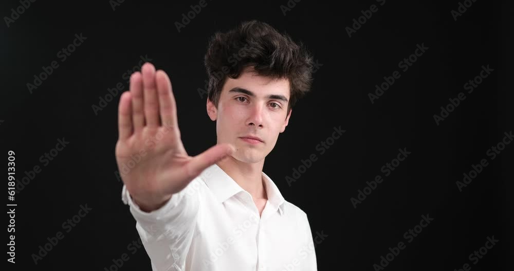 Stern and commanding Caucasian man standing on striking black ...